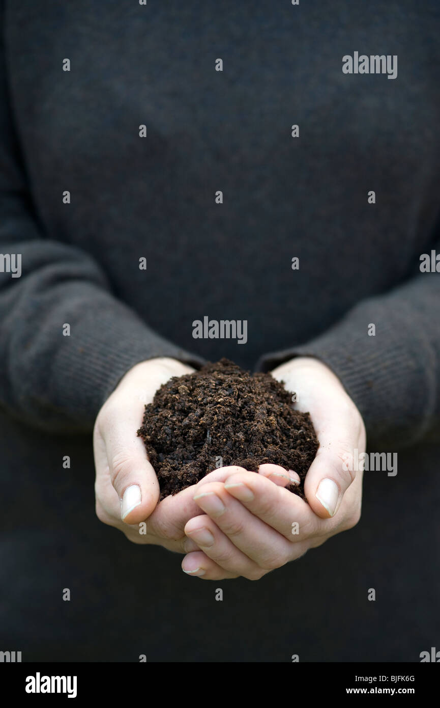 Compost in hands hi-res stock photography and images - Alamy