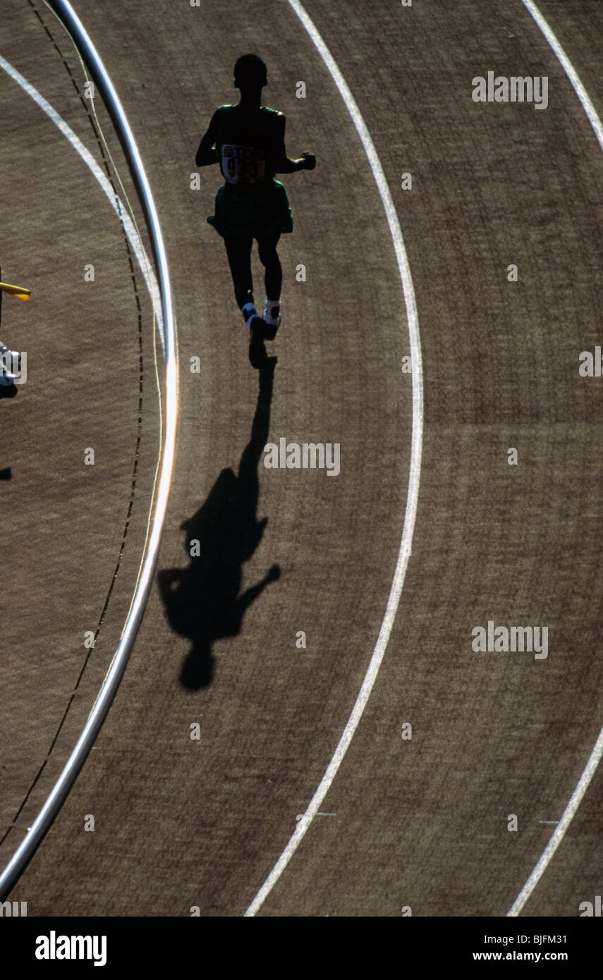 Person running on track Stock Photo - Alamy
