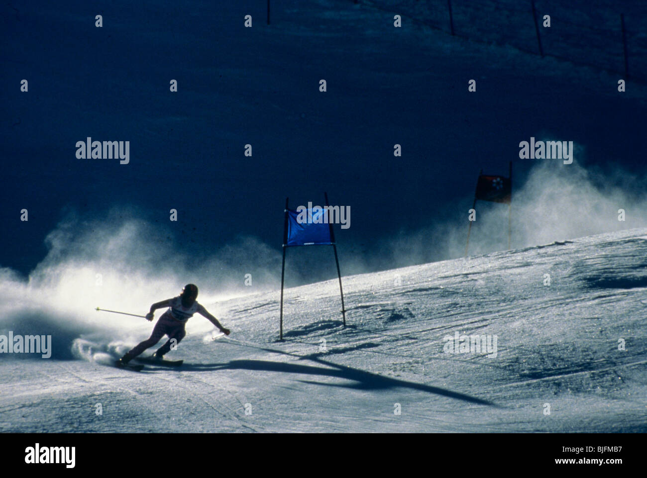 Skier racing down a slalom run Stock Photo - Alamy