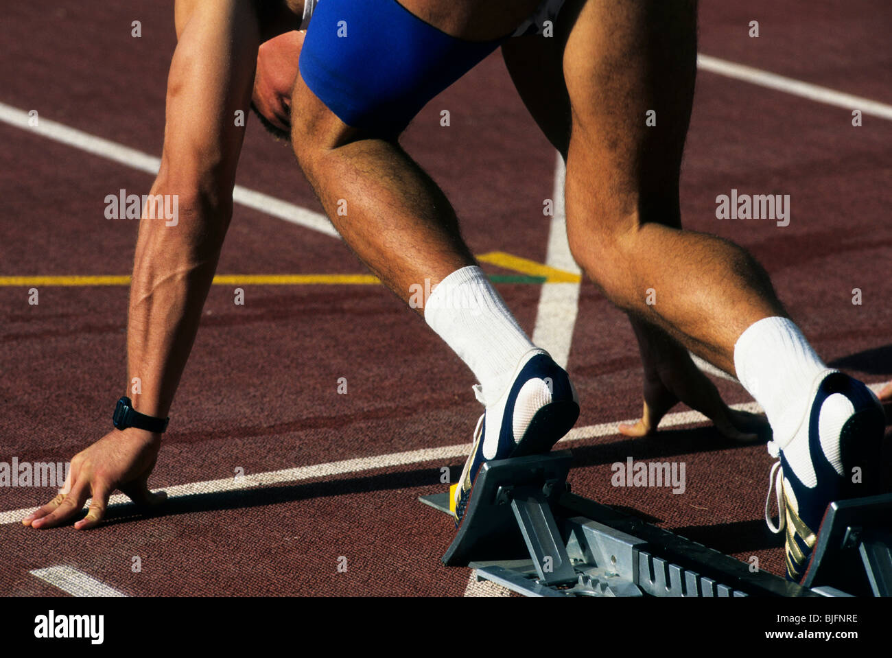 Close up of a sprinter in the starting block Stock Photo - Alamy