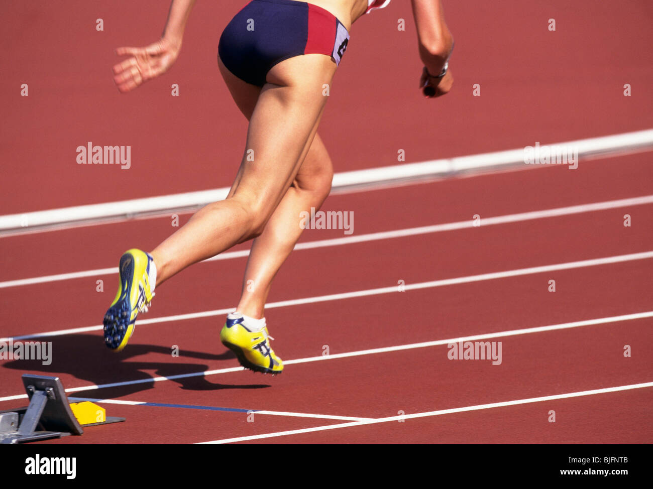 Sprinter leaving the starting block at the start of a race Stock Photo ...