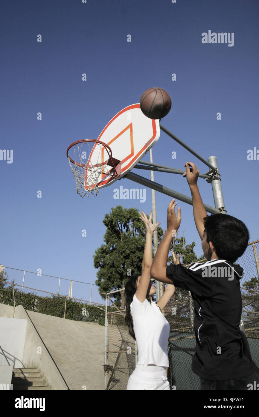 Two children playing basketball Stock Photo - Alamy
