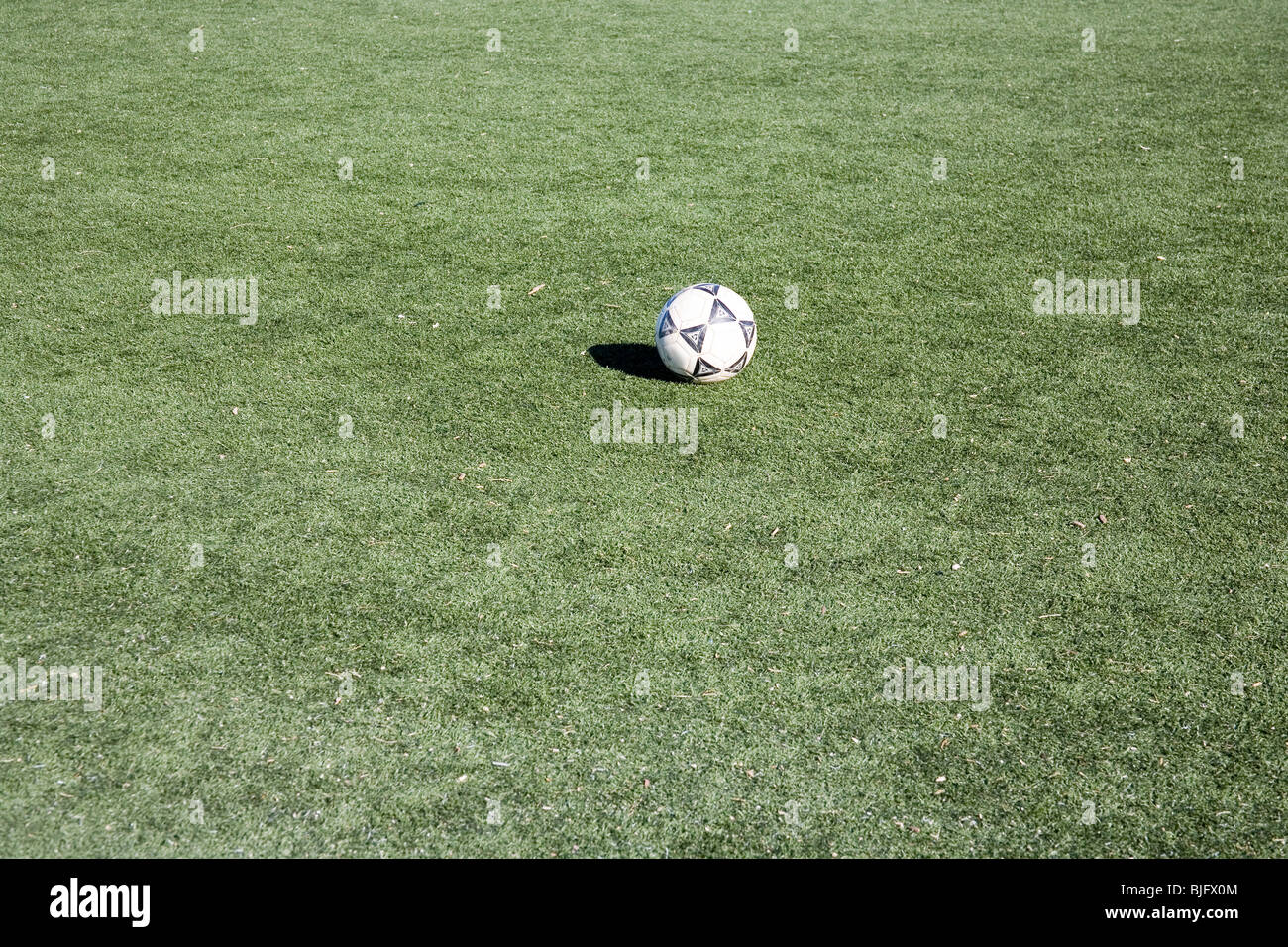 Football on a pitch Stock Photo - Alamy