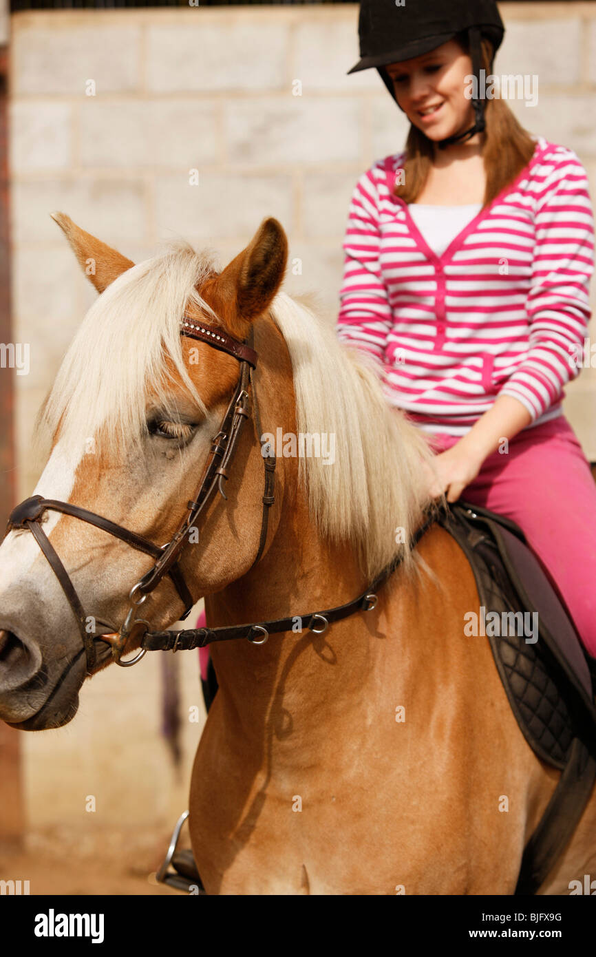 Woman horse back riding Stock Photo - Alamy