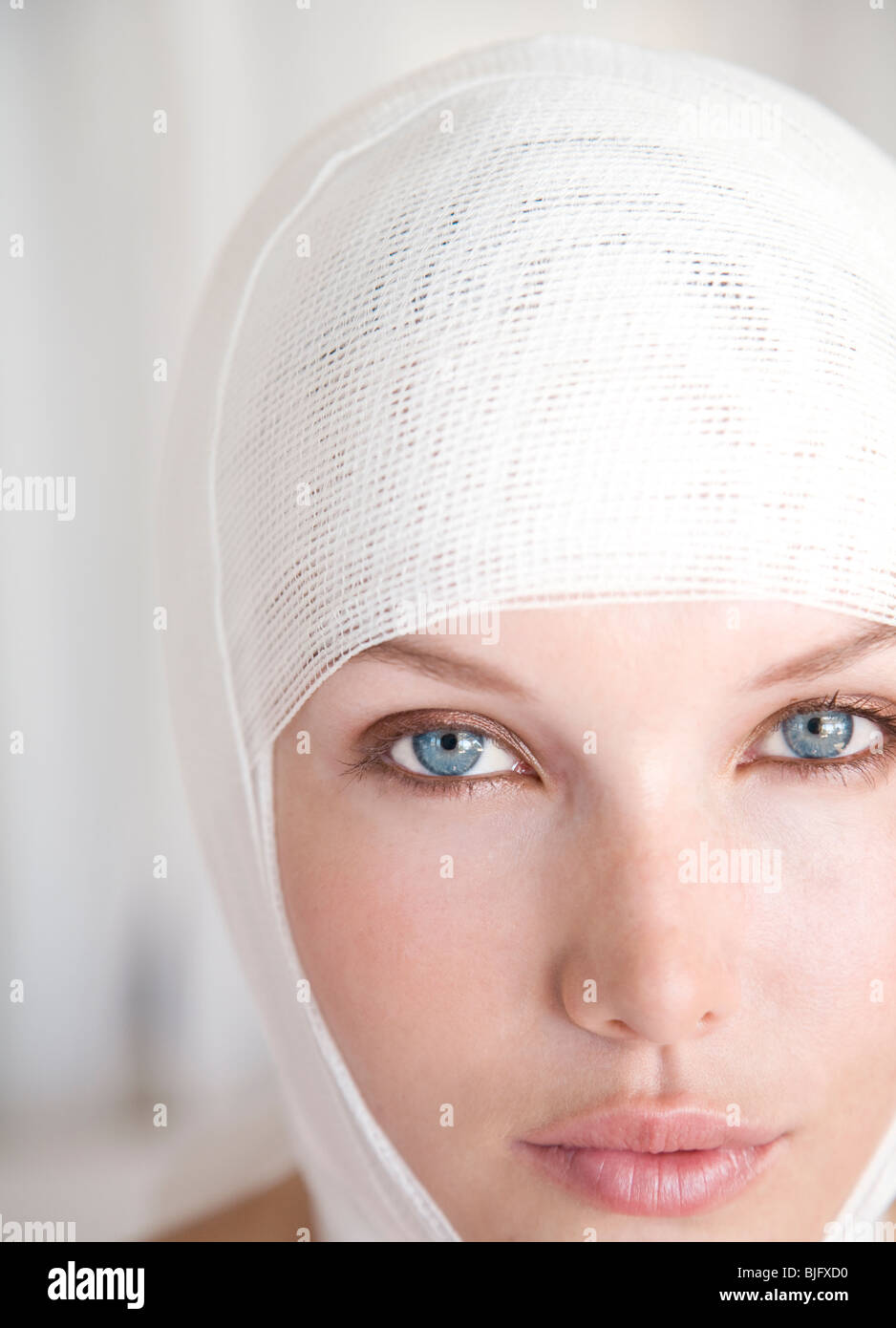 Young woman plastic around head hi-res stock photography and images - Alamy