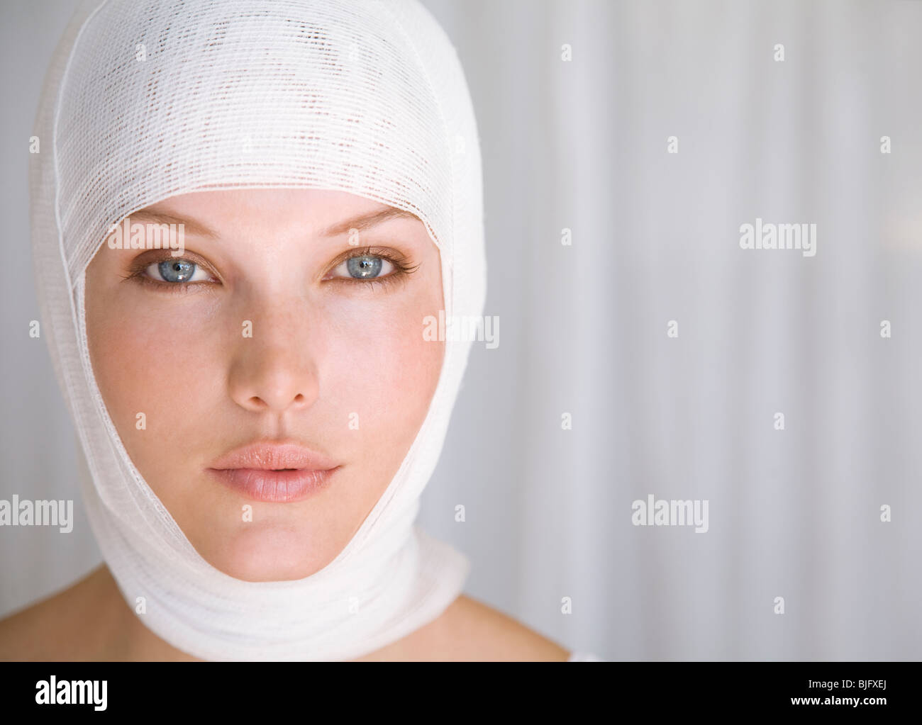 Young woman plastic around head hi-res stock photography and images - Alamy