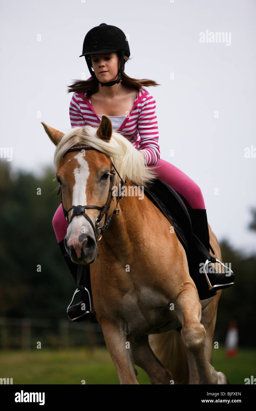 Woman horse back riding Stock Photo - Alamy