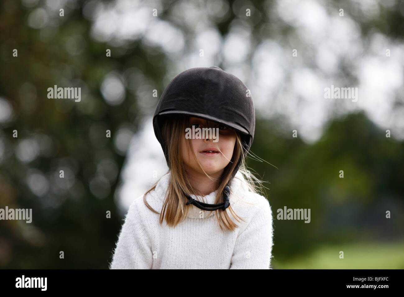 Young girl horse back riding Stock Photo - Alamy