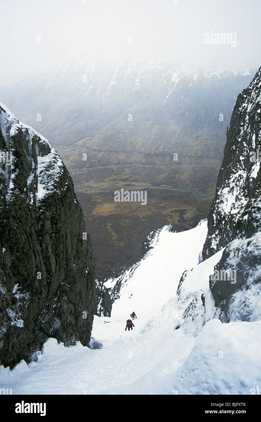 Mountain climbers in a snow filled crevice Stock Photo - Alamy