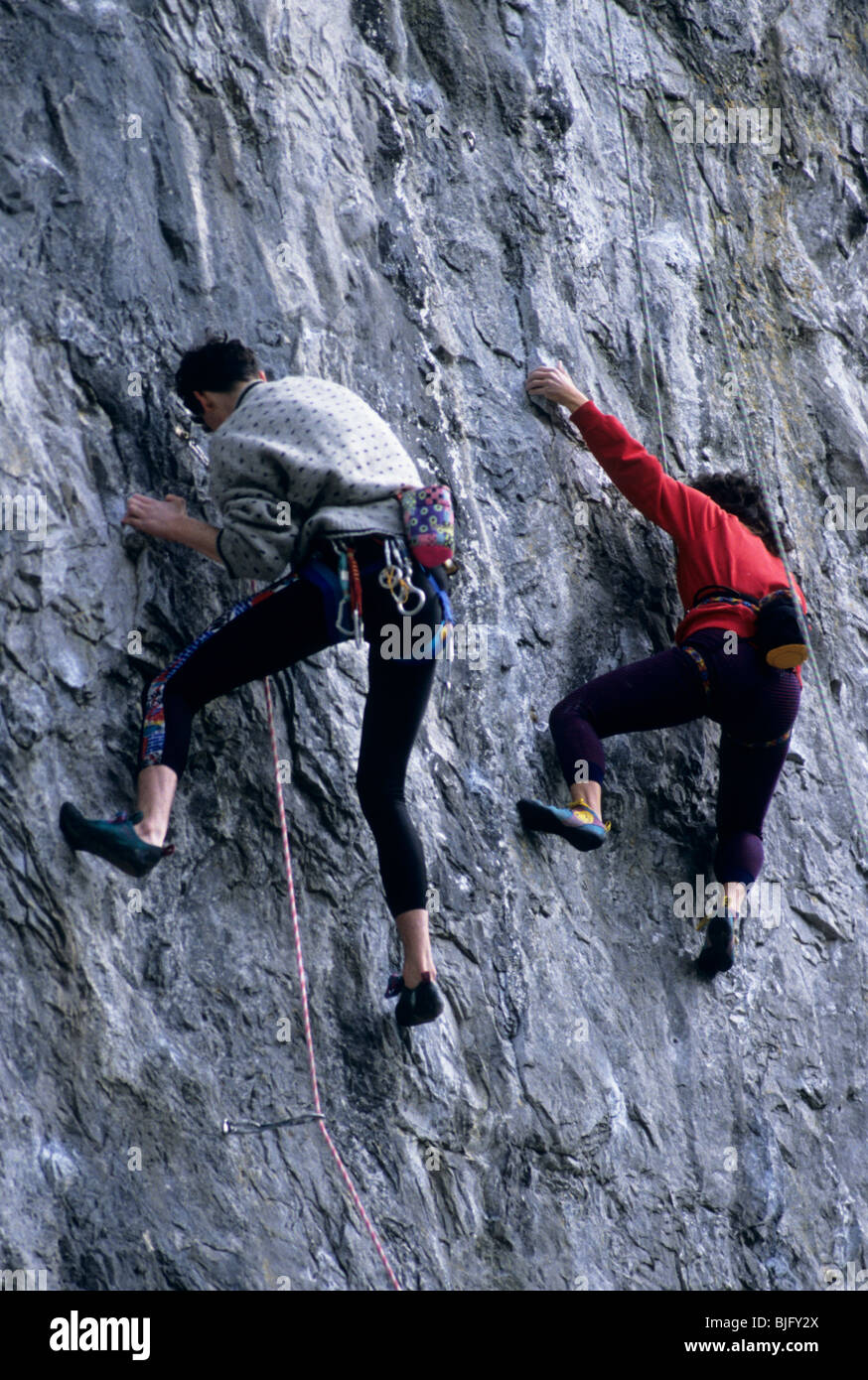 Mountaineers scaling a rock face Stock Photo - Alamy