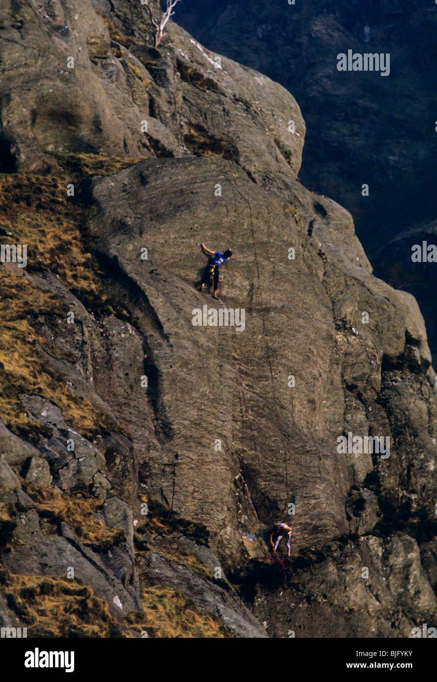 Mountaineers scaling a rock face Stock Photo - Alamy