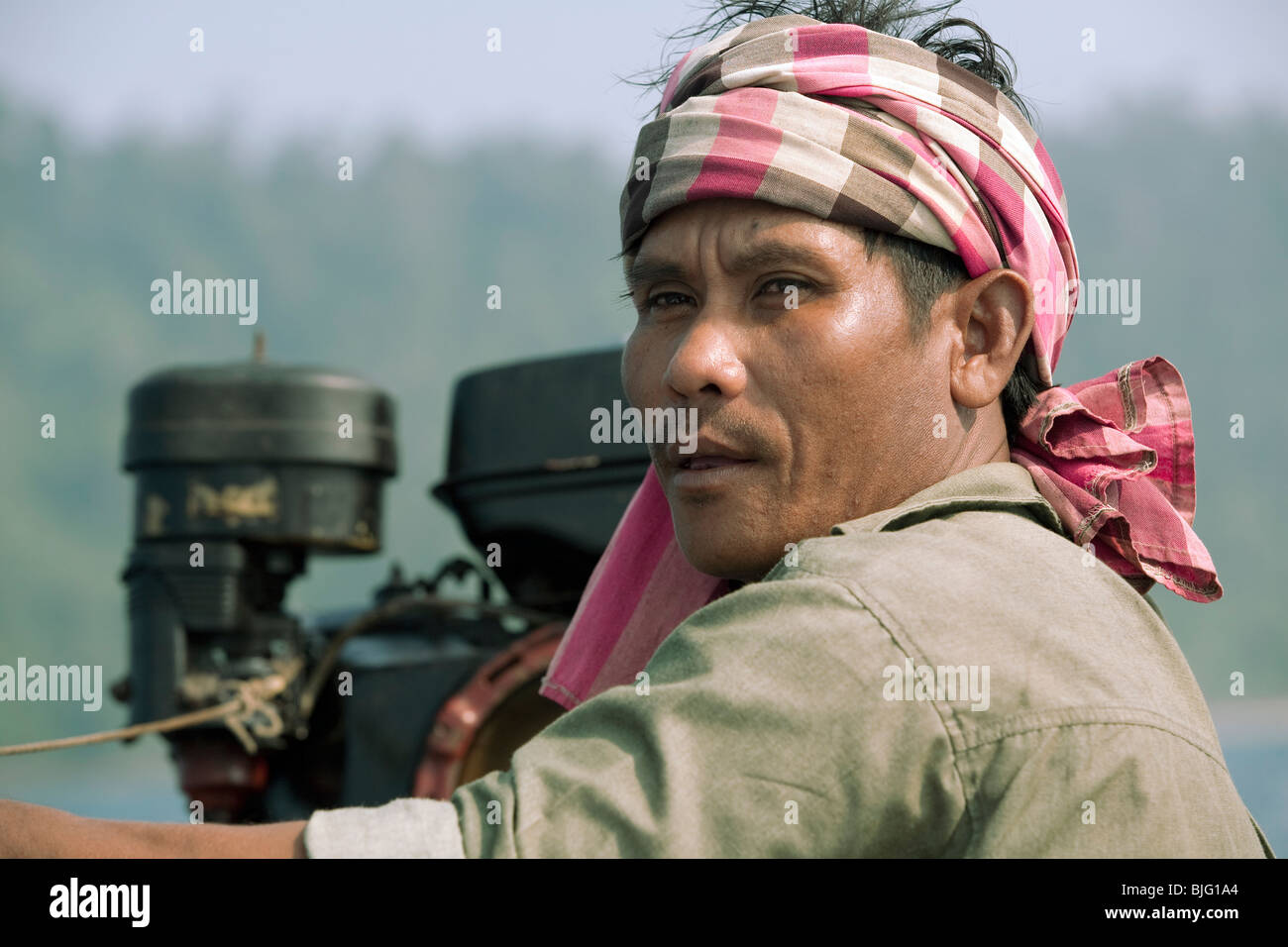 Man driving a boat. Myanmar sea-gypsies, the nomadic hunter-gatherers ...