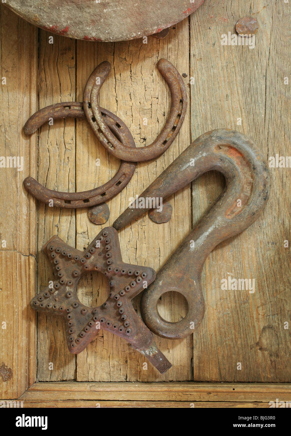 rusty old west metal items on wooden table Stock Photo - Alamy