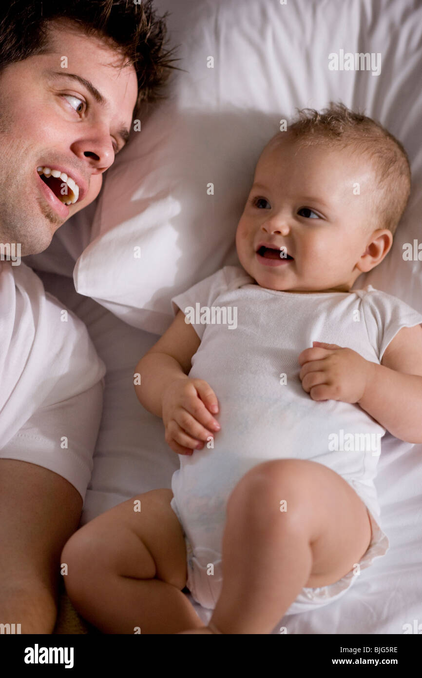 Family of three people sleeping in one bed hi-res stock photography and ...