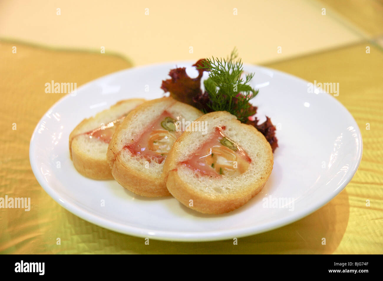 garnished italian crisp bread served in a white dish Stock Photo - Alamy