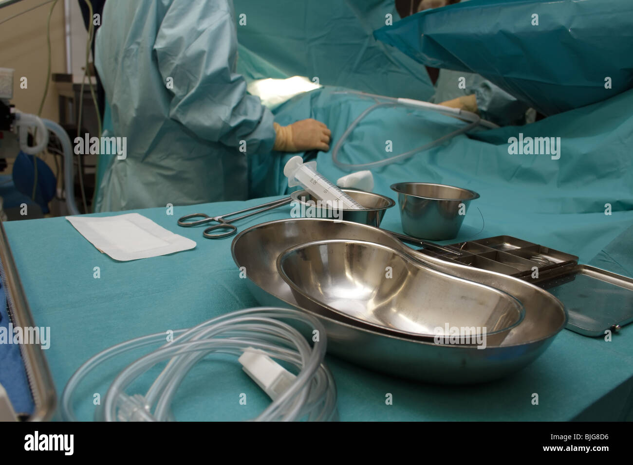 Surgical equipment with operation in background. Short DOF Stock Photo ...