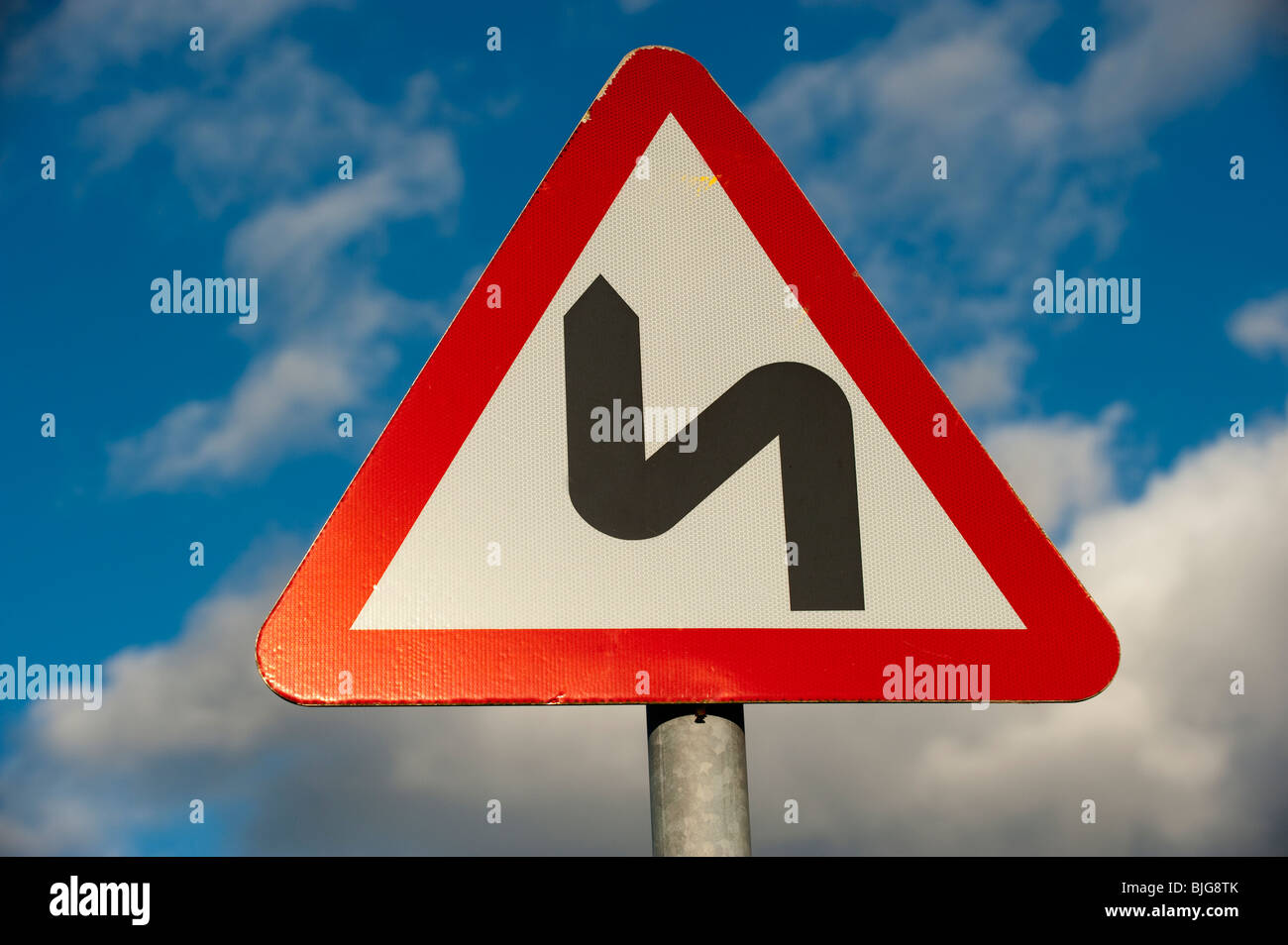 Sharp bends ahead road sign Stock Photo - Alamy Sharp bends ahead road sign Stock Photo - Alamy