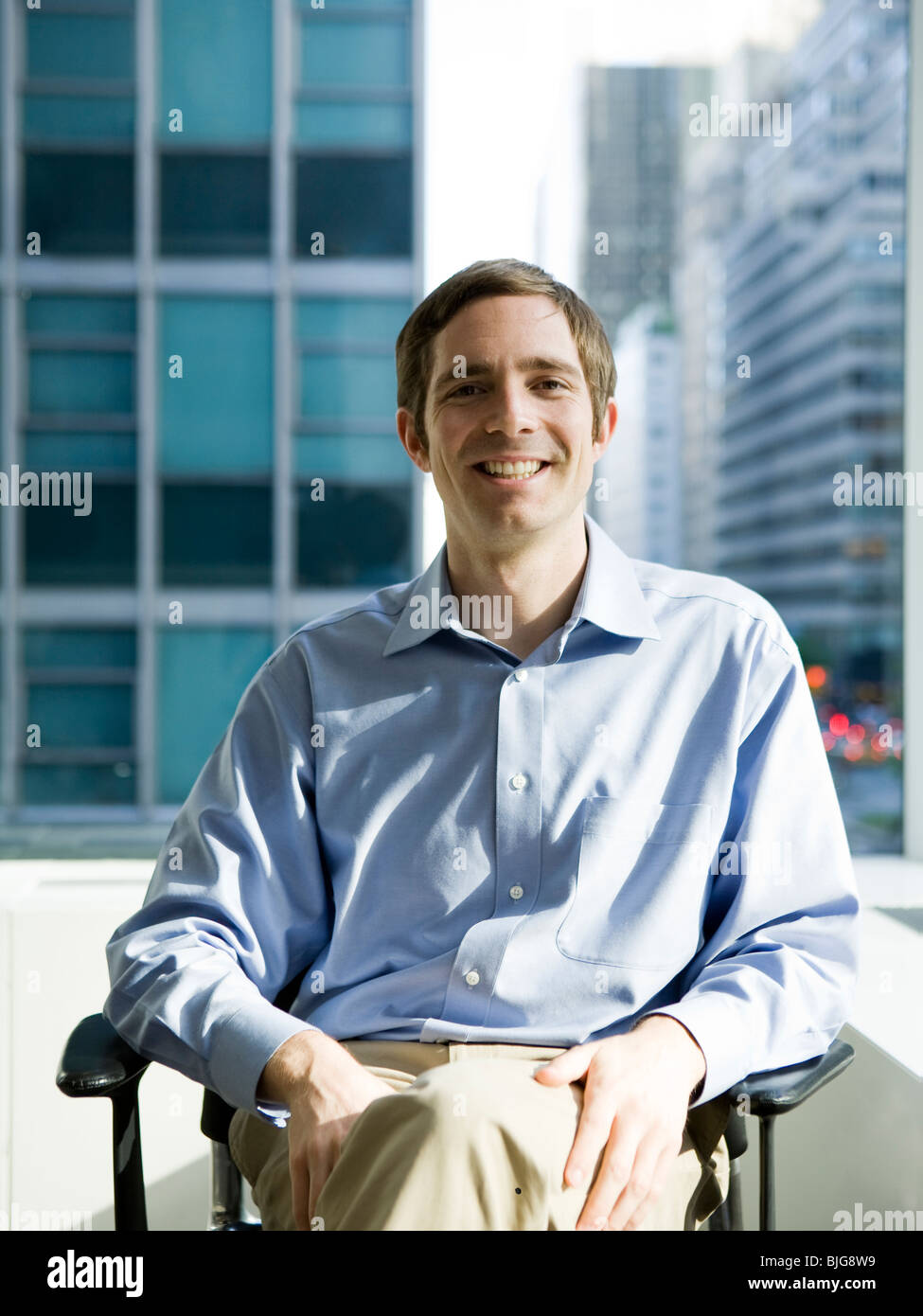 man in a blue shirt at work Stock Photo - Alamy