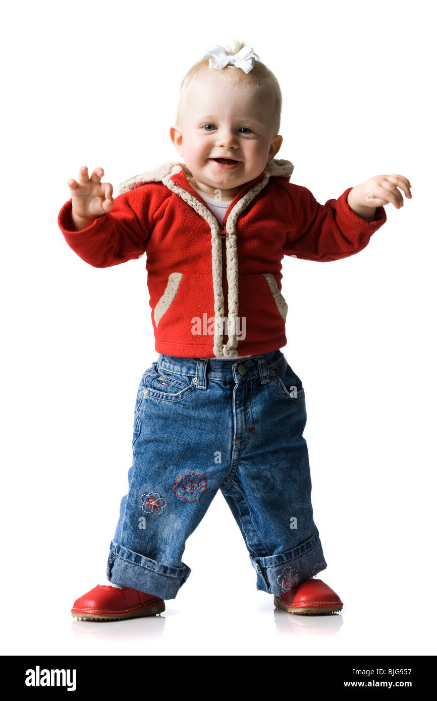 baby girl in a red coat Stock Photo - Alamy