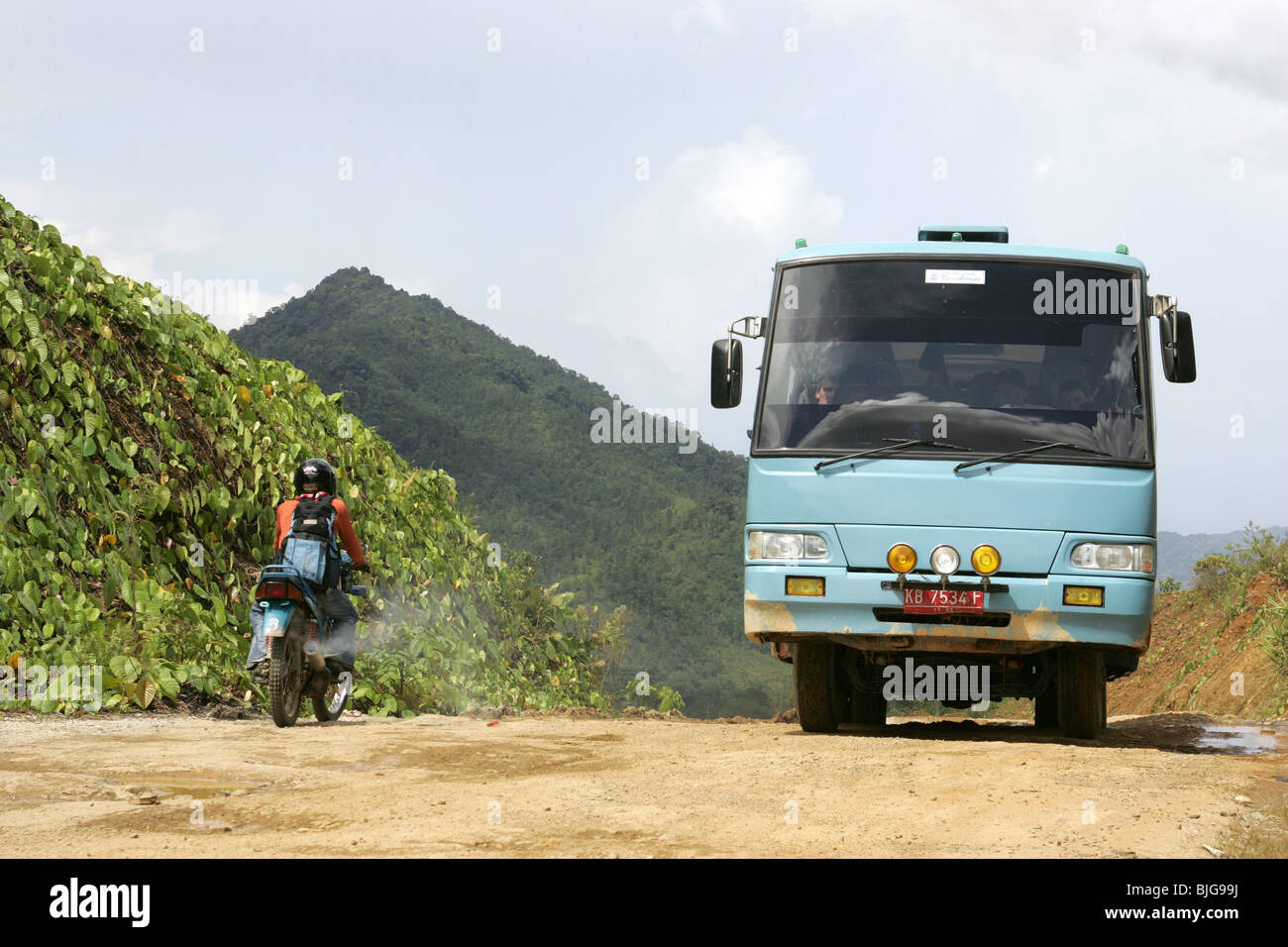 A bus travels the mud roads of Indonesian Borneo Stock Photo - Alamy