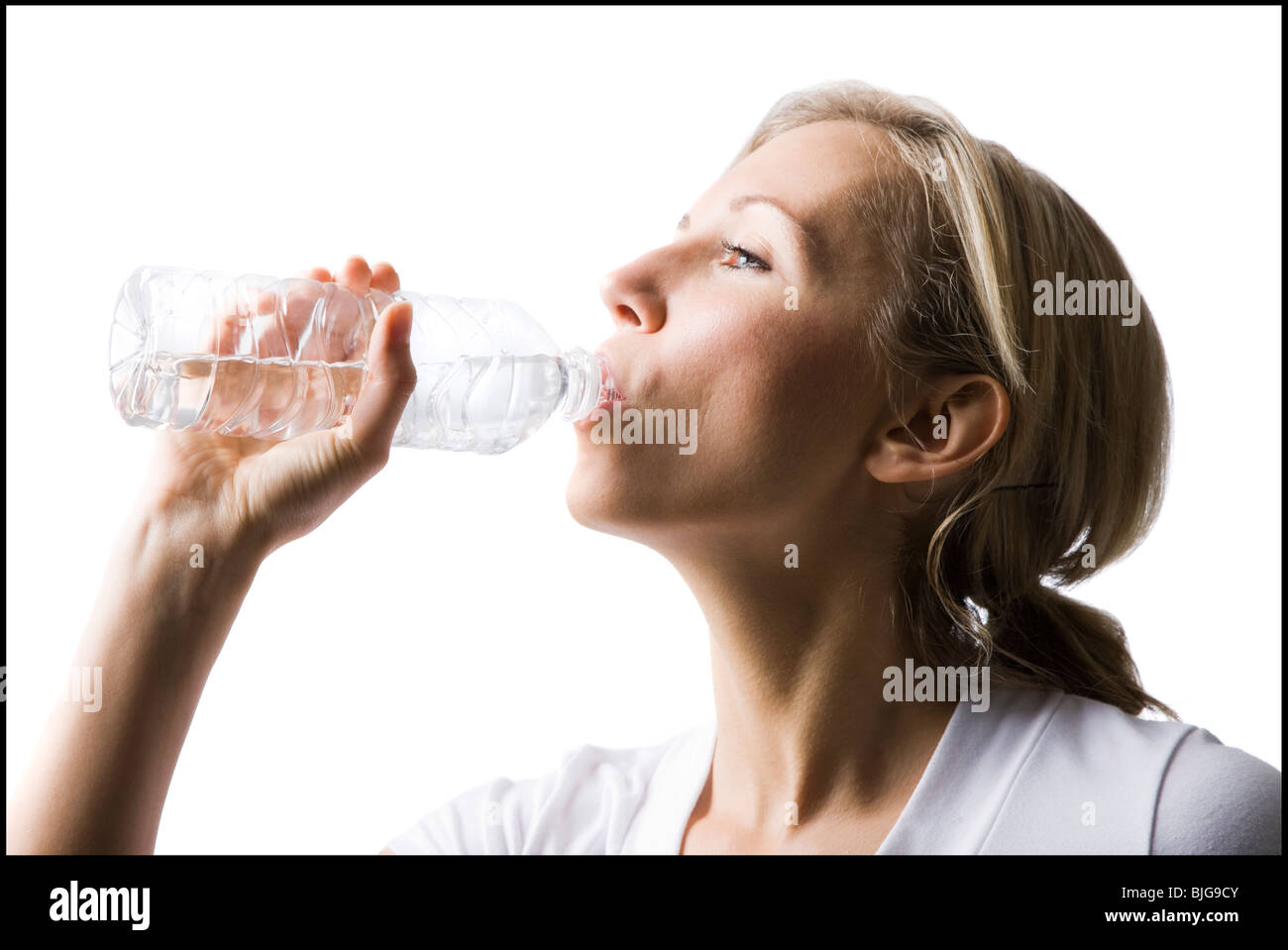 woman drinking a bottled water Stock Photo - Alamy