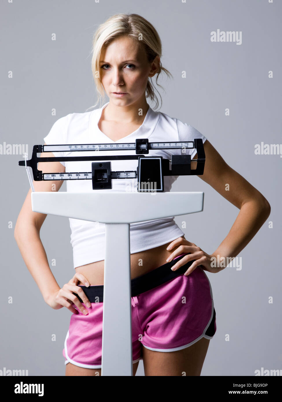 woman on a scale Stock Photo - Alamy