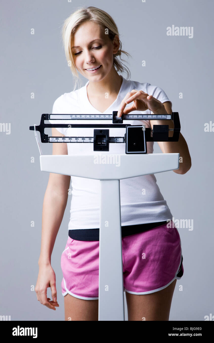 woman on a scale Stock Photo - Alamy