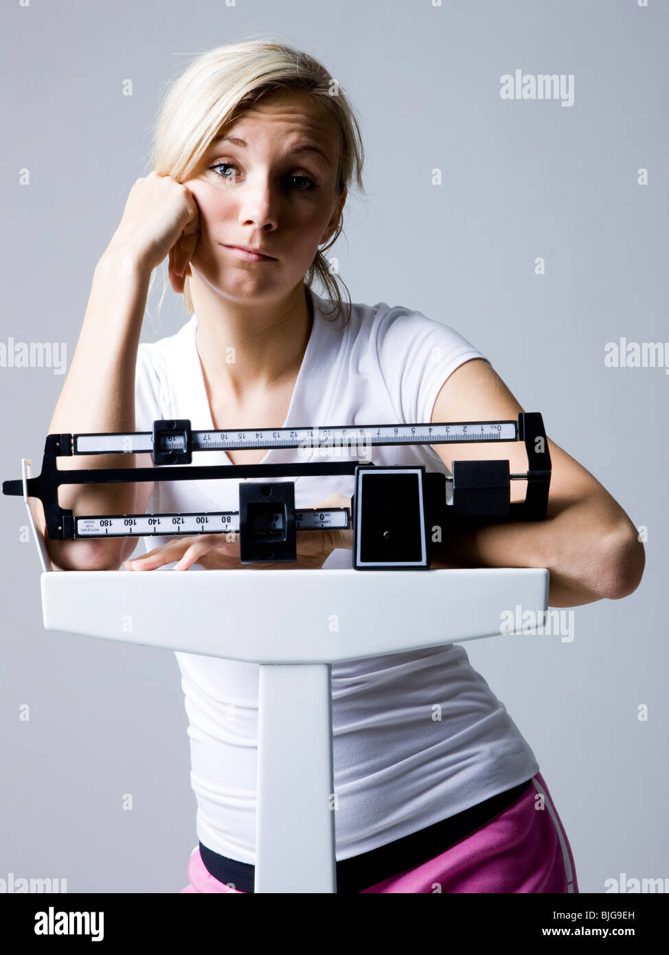 woman on a scale Stock Photo - Alamy