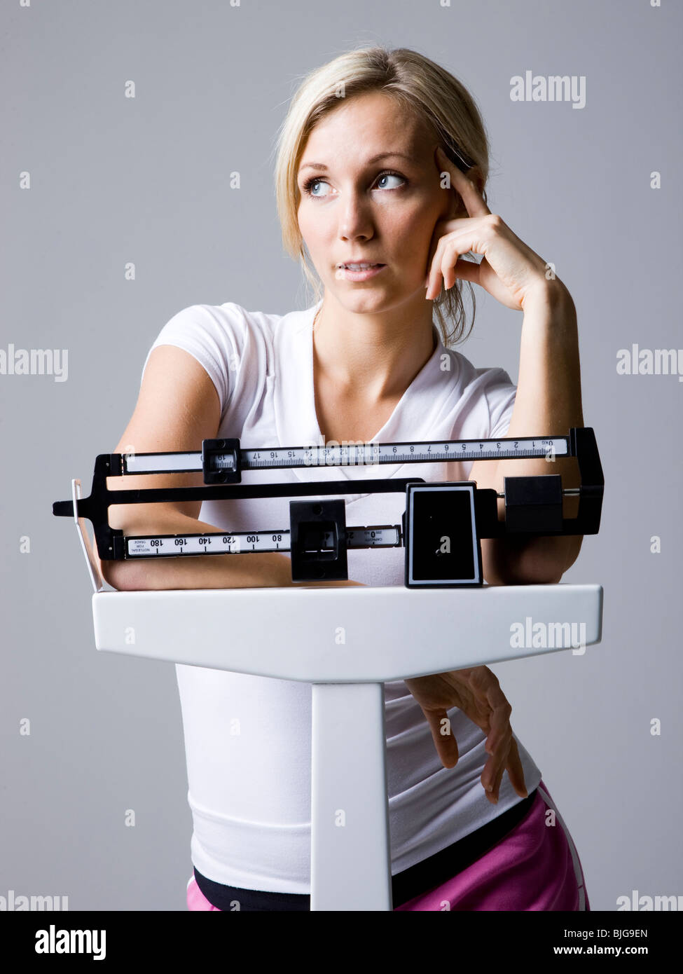 woman on a scale Stock Photo - Alamy