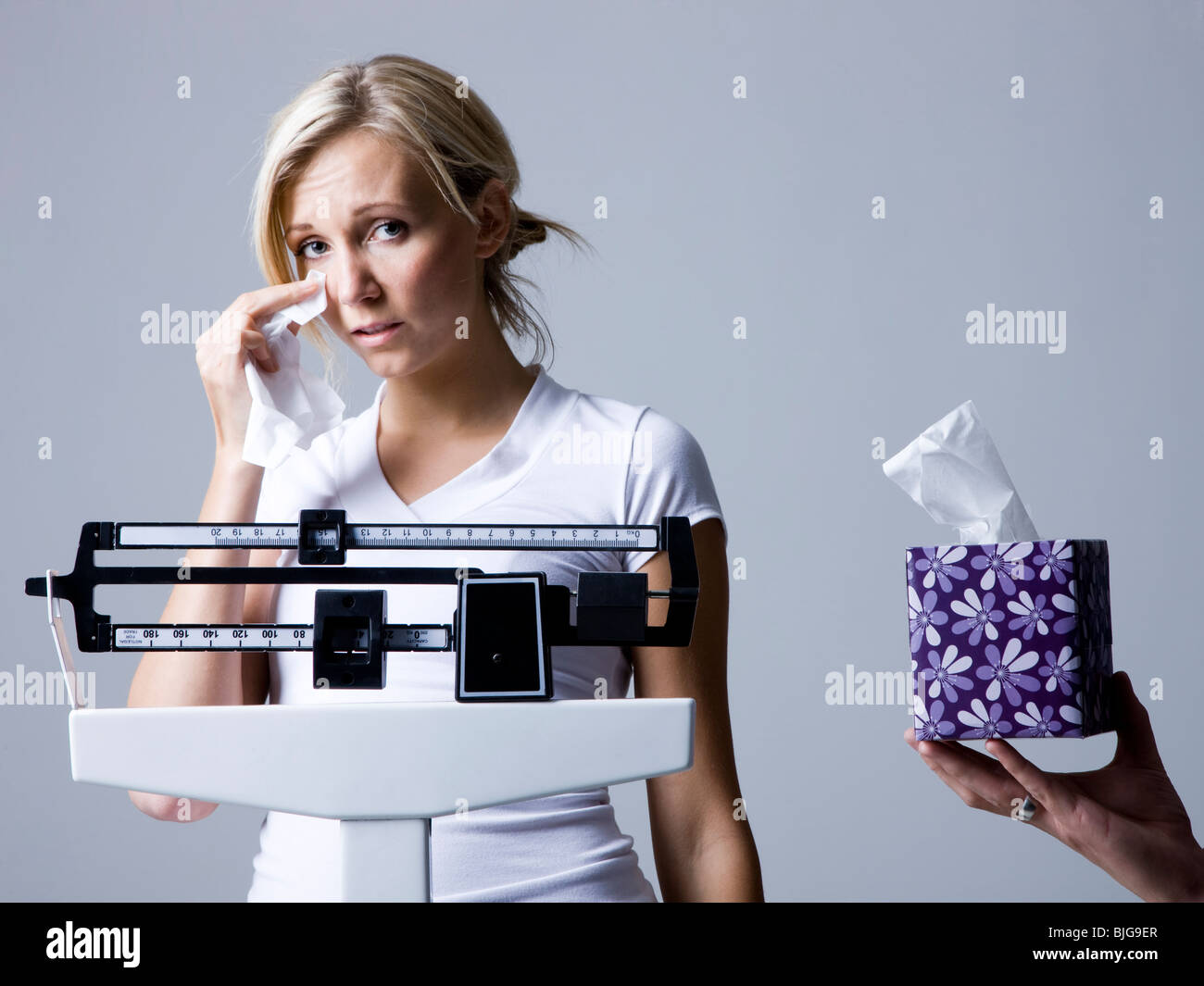 woman on a scale Stock Photo - Alamy