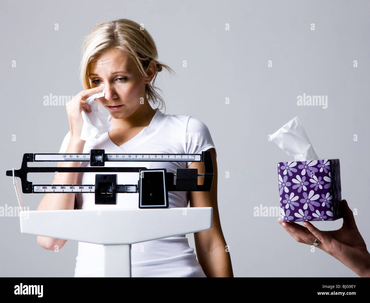 woman on a scale Stock Photo - Alamy