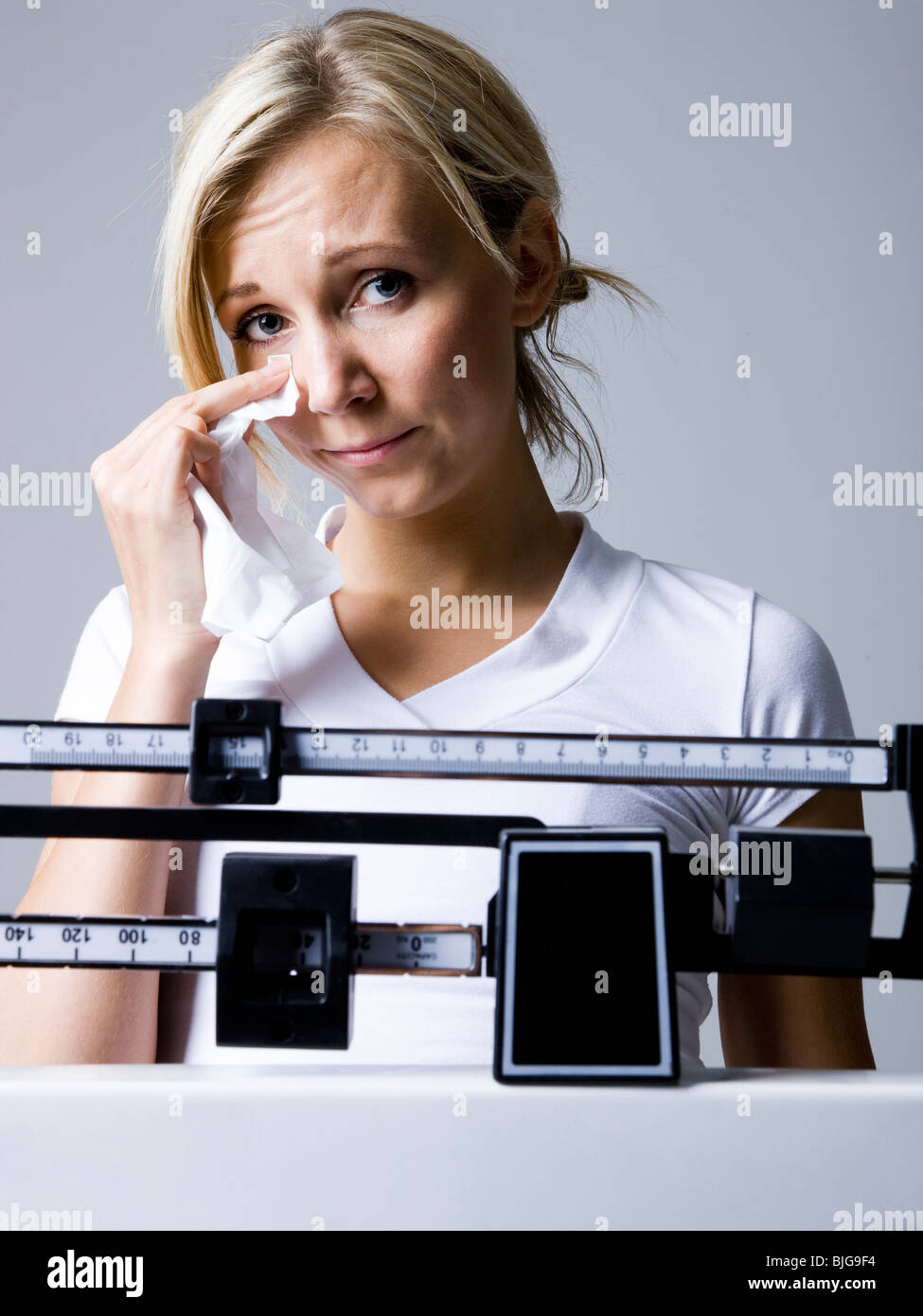 woman on a scale Stock Photo - Alamy