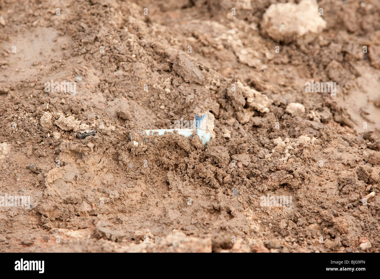 Ventolin Asthma inhaler dropped in muddy field Stock Photo - Alamy