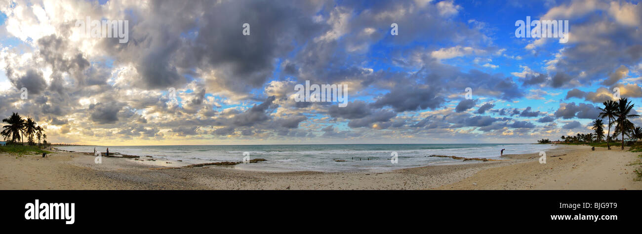 Panoramic view of tropical cuban beach at sunset with dramatic clouds ...