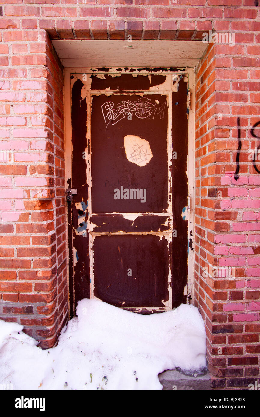 A snowed-in door in an alleyway Stock Photo - Alamy