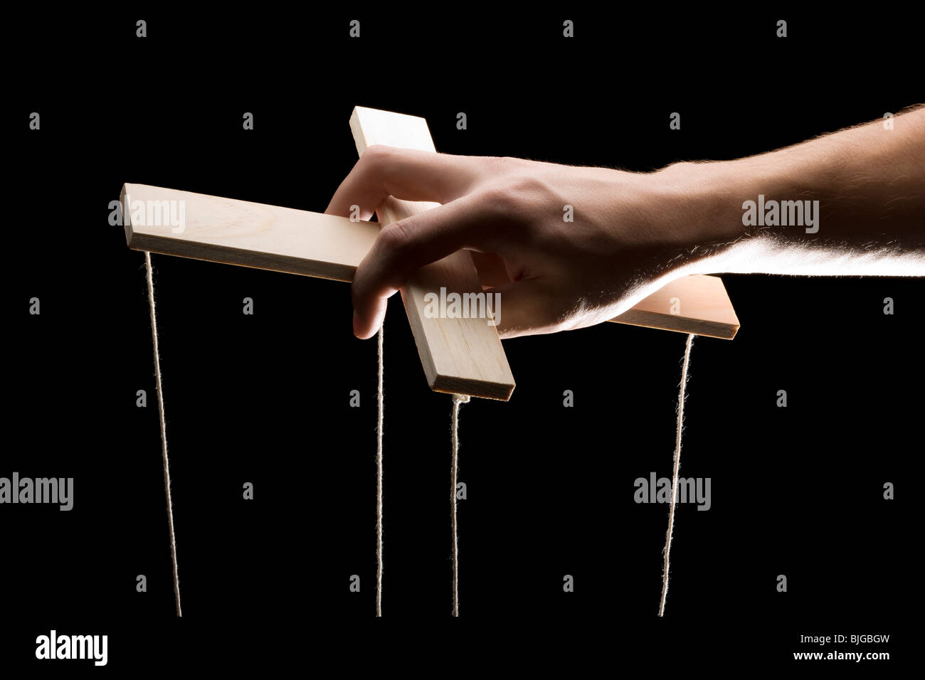 hand holding a puppet cross beam Stock Photo - Alamy