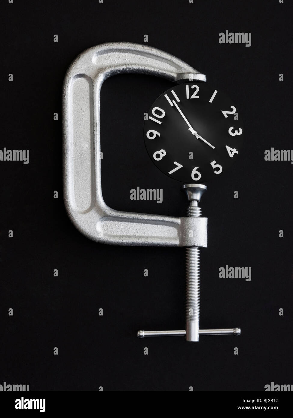 clock in a clamp Stock Photo - Alamy