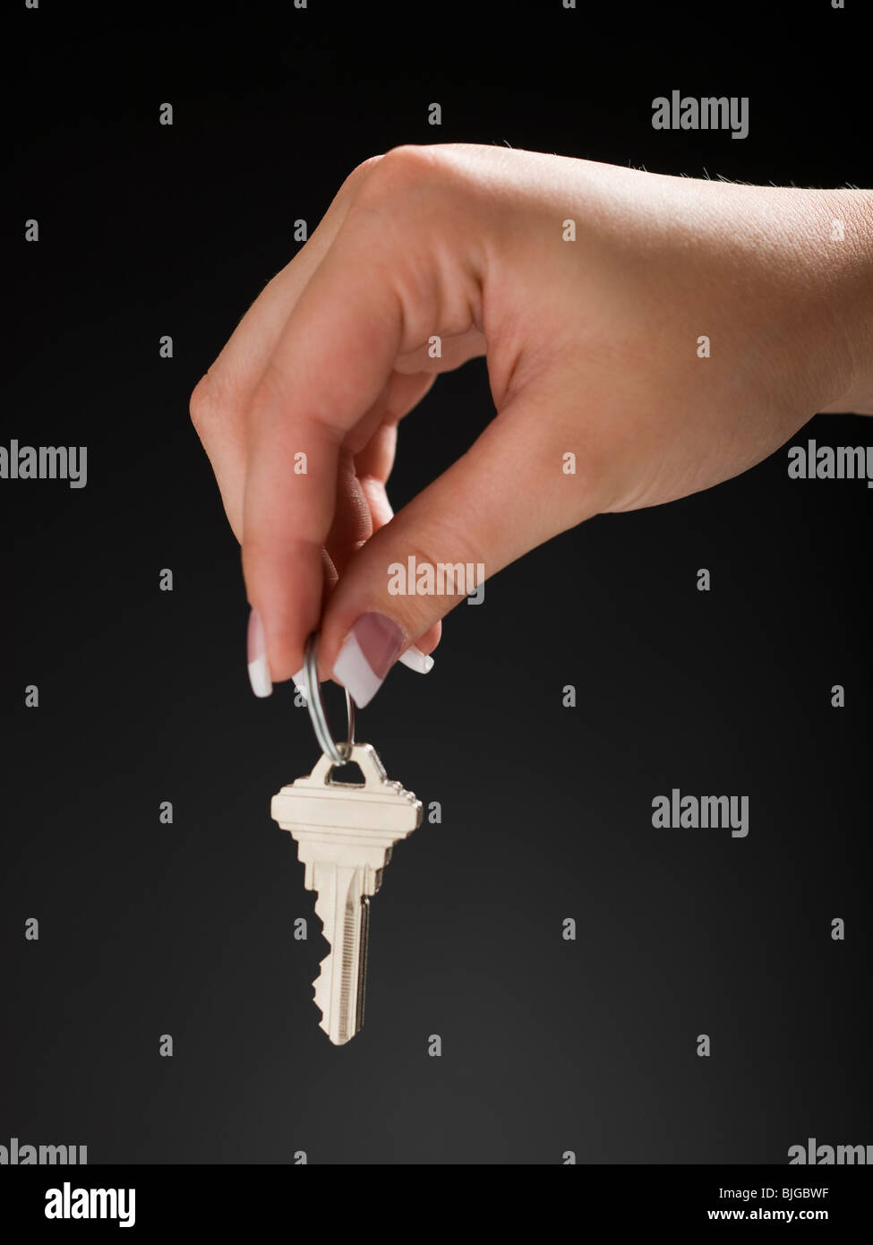 Hand holding keys Stock Photo - Alamy