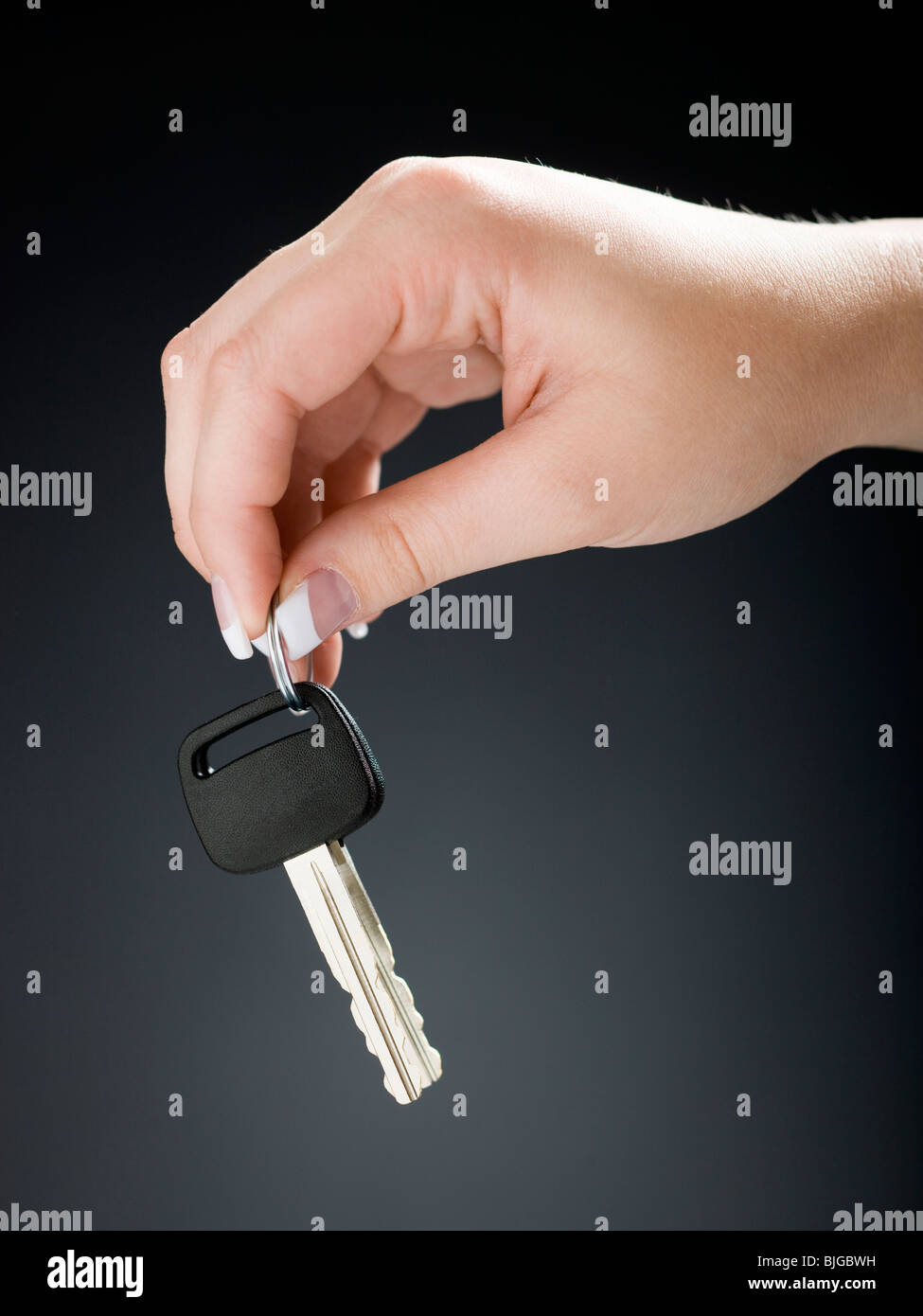 Hand holding keys Stock Photo - Alamy
