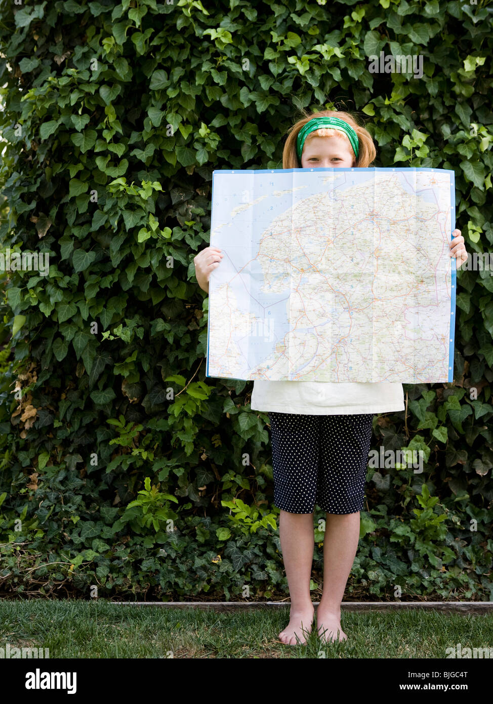 girl holding a map Stock Photo - Alamy