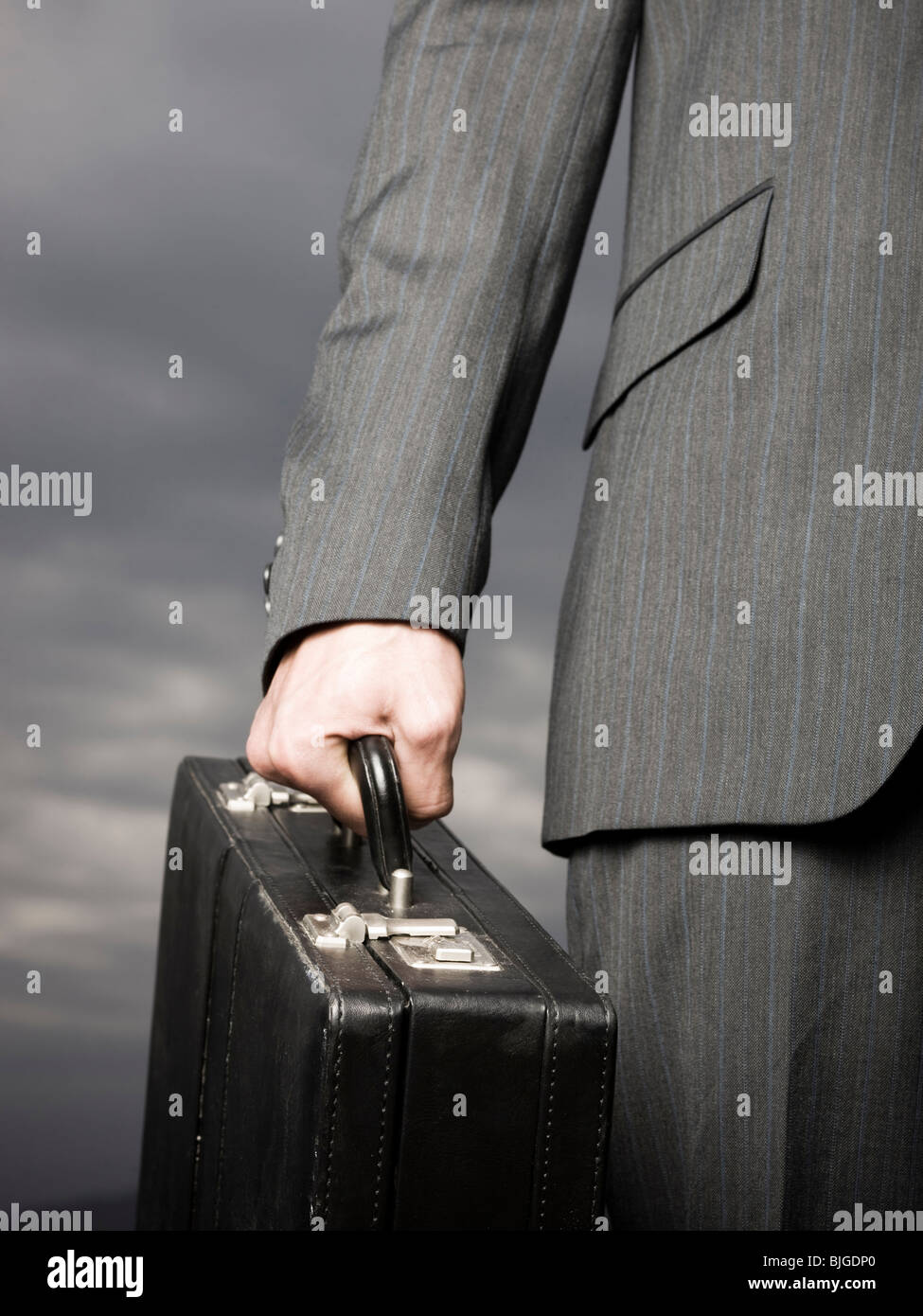 man holding a briefcase Stock Photo - Alamy