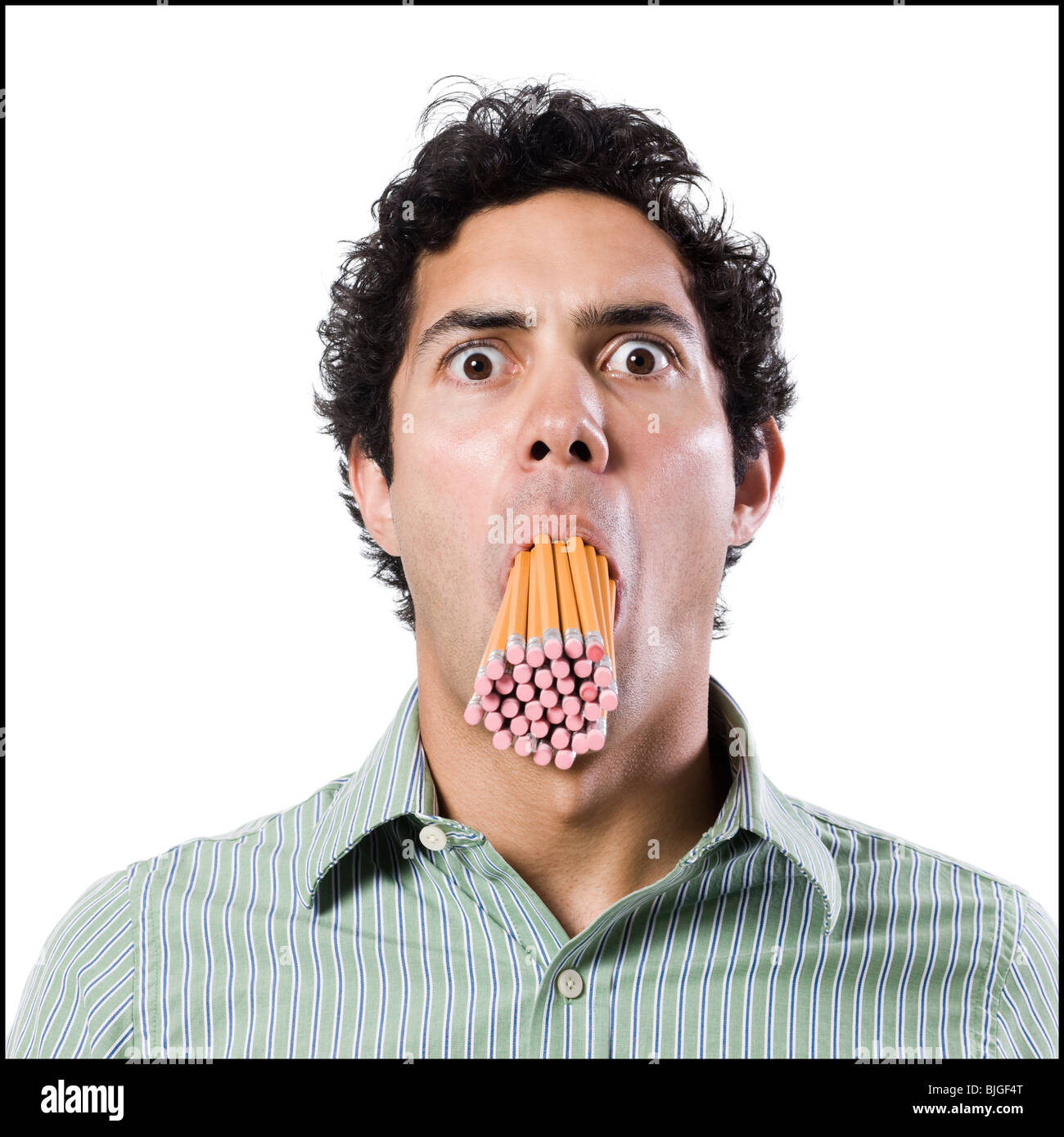 man with a mouth full of pencils Stock Photo - Alamy