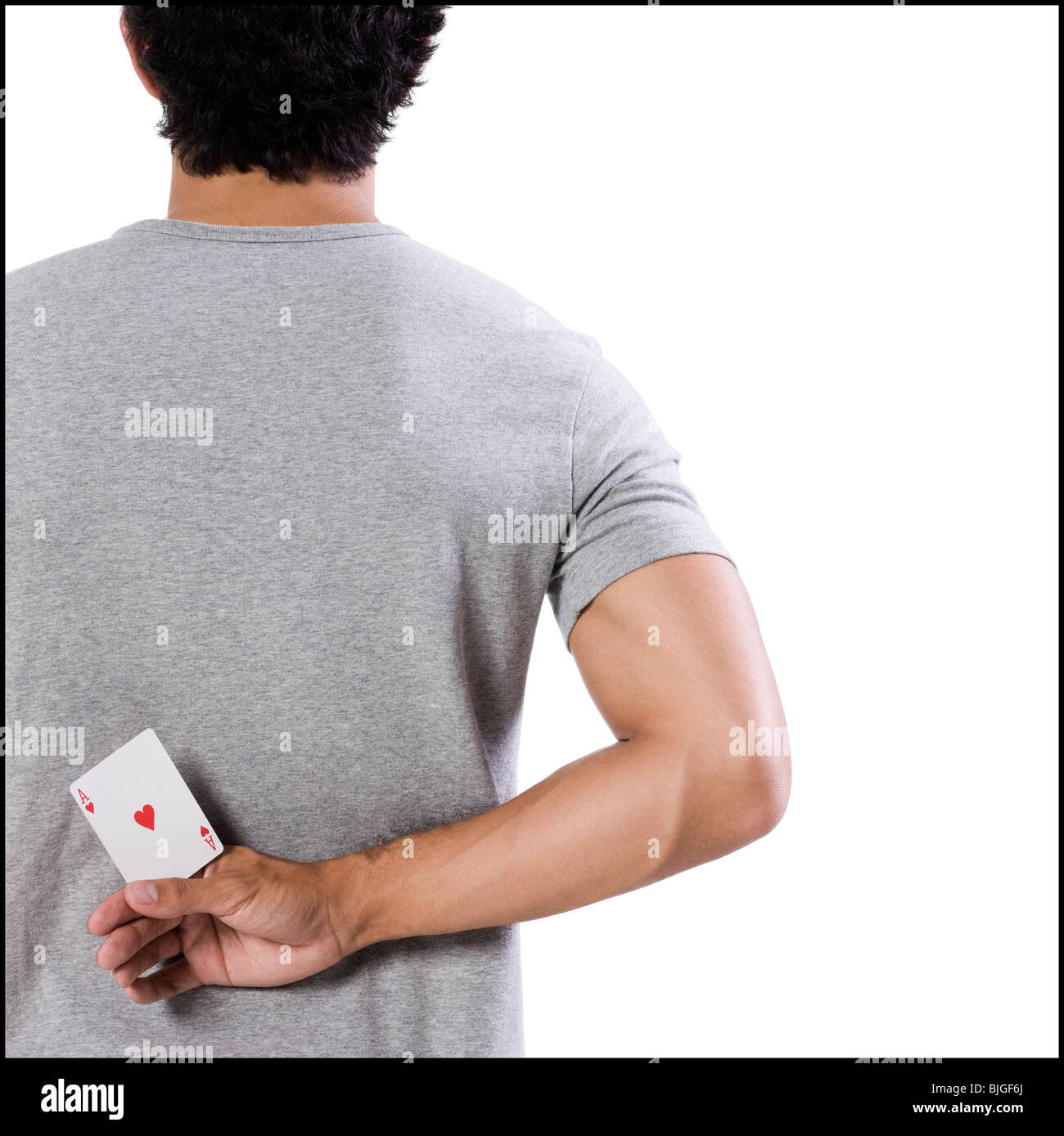 man holding an ace card behind his back Stock Photo - Alamy