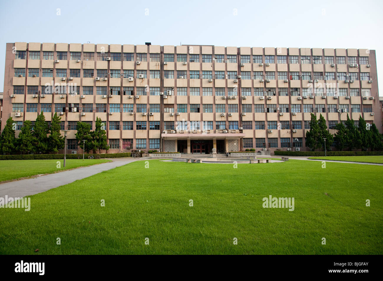Building with many air conditioning units on campus of Fudan University ...
