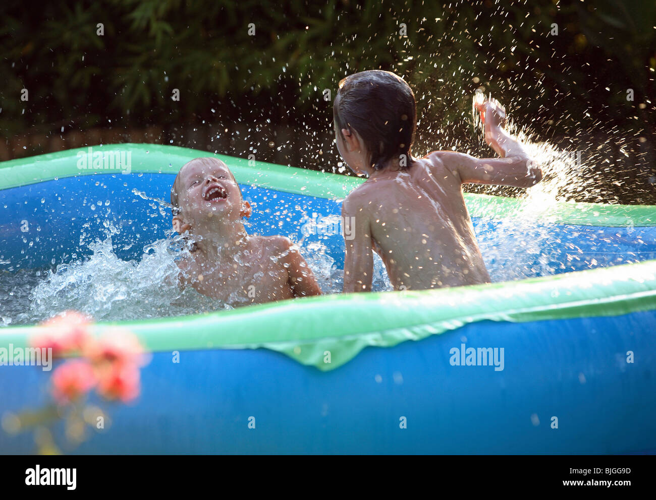 Kids Splashing In Paddling Pool High Resolution Stock Photography and ...