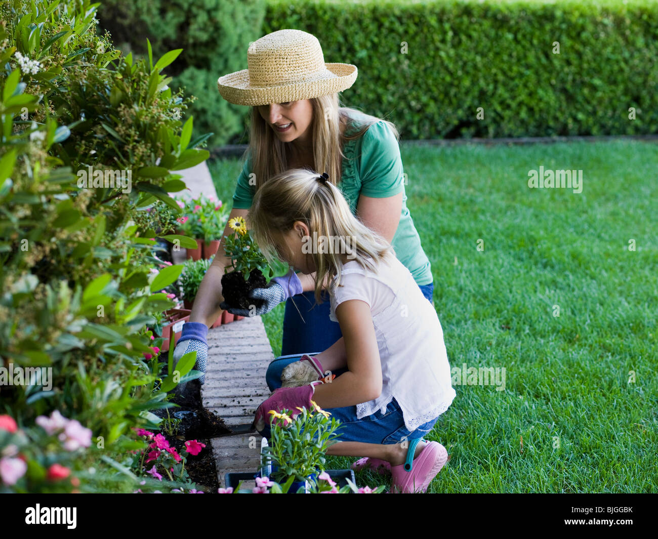 mother and daughter in the garden Stock Photo - Alamy