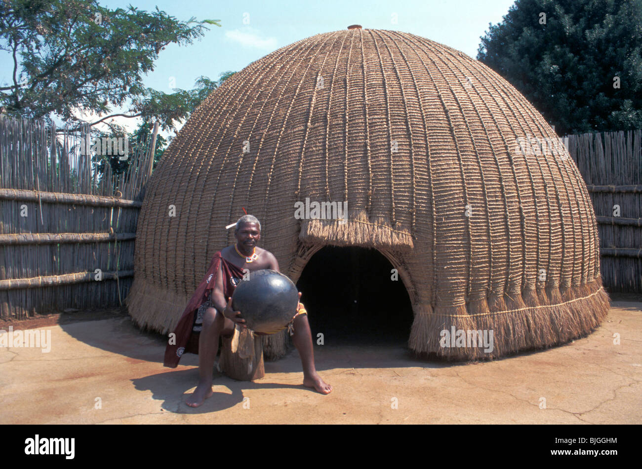 SWAZILAND SWAZI MEDICINE MAN OUTSIDE HIS VILLAGE HUT. Photograph by ...