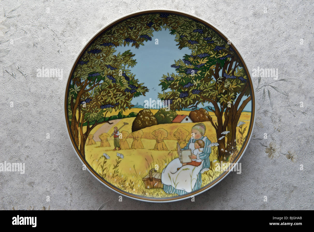 Painted ceramic plate depicting a German farming family during harvest ...