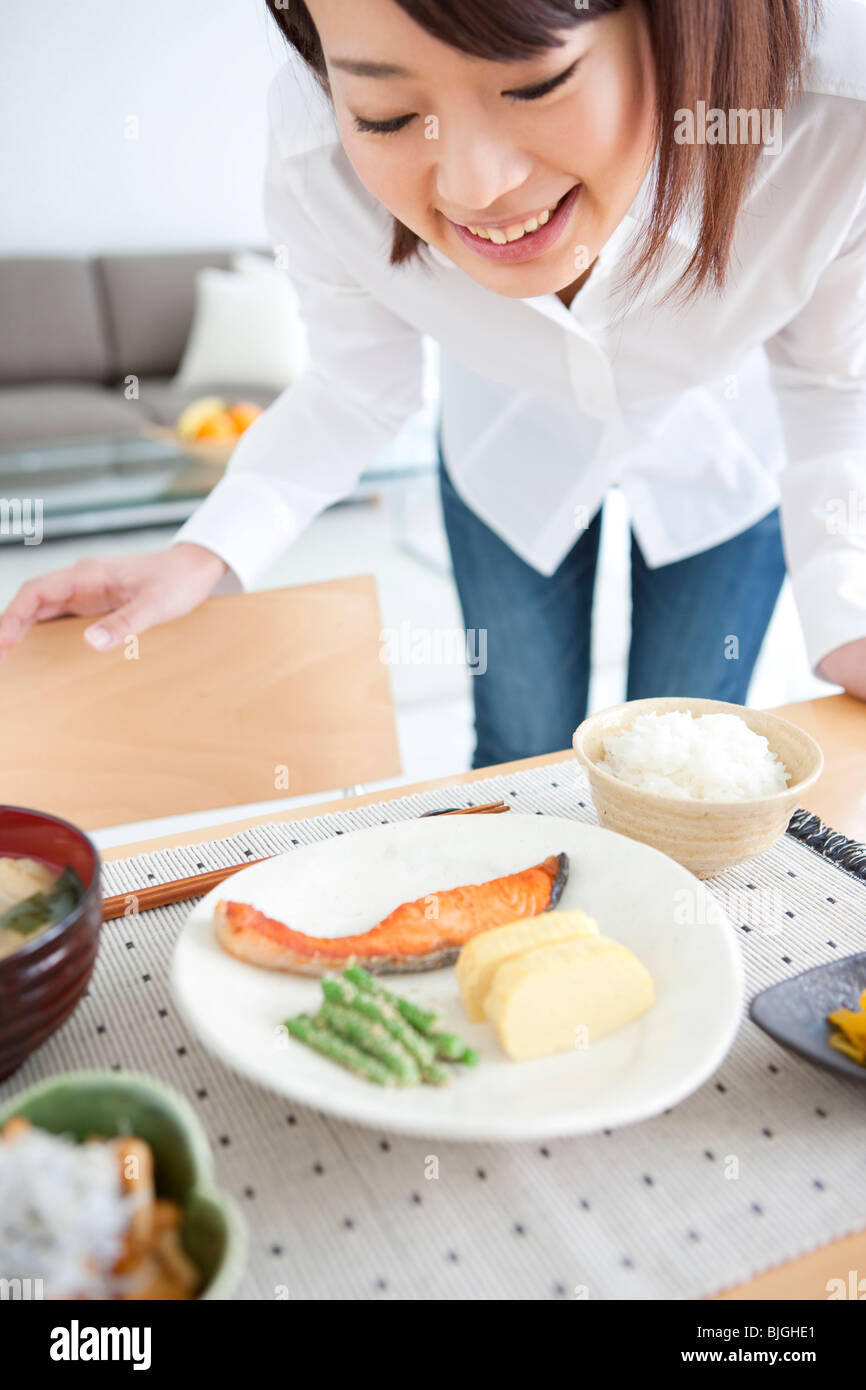 Woman bending over table hi-res stock photography and images - Alamy