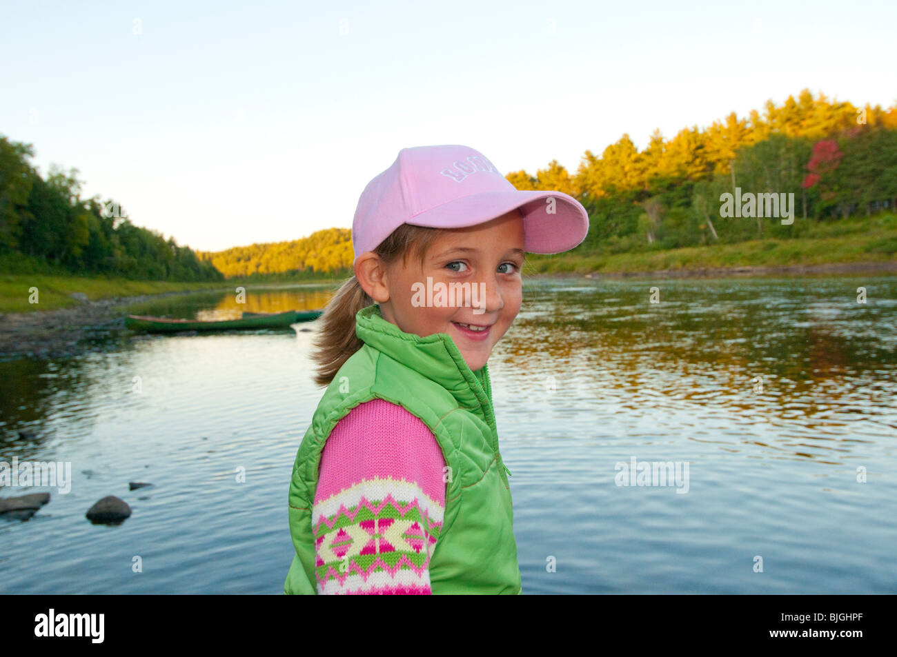 NEW BRUNSWICK, Young female girl fishing for Atlantic Salmon on the ...